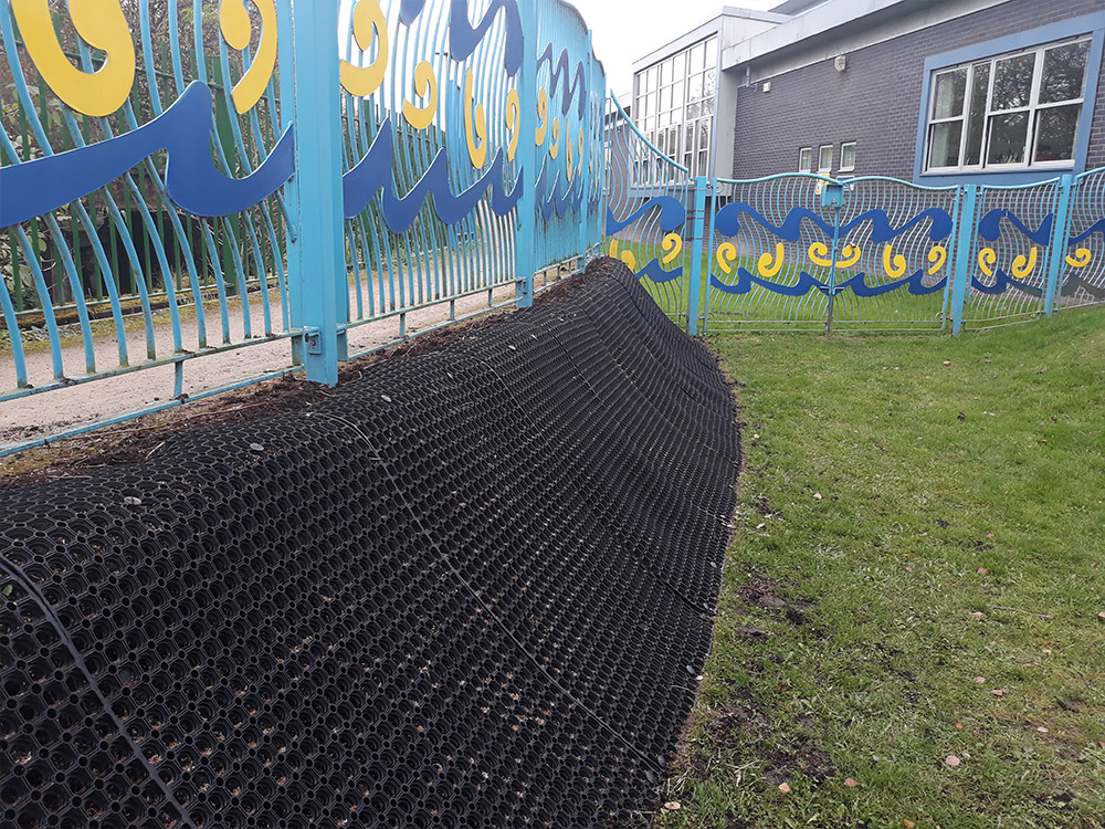 Grass Mats Covering A Soil Bank With Metal Frame Work